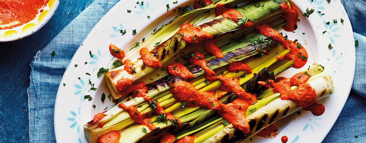 Charred leeks with romesco sauce